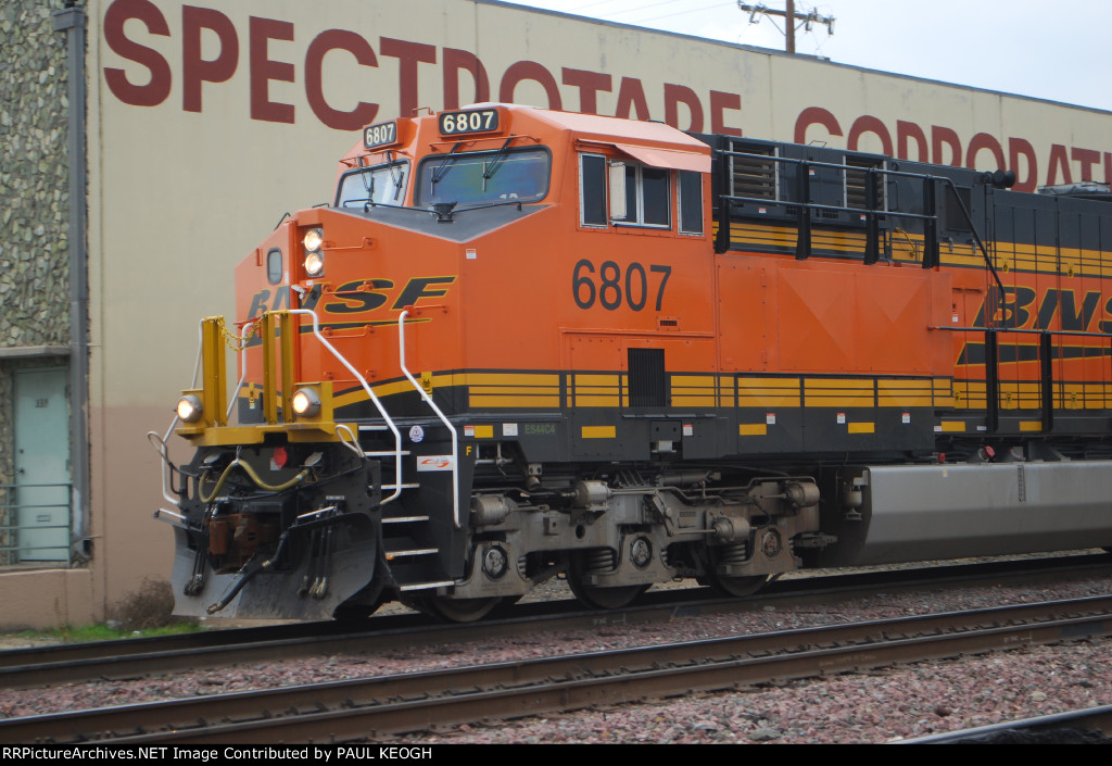BNSF 6807 Cab Shot as she heads west on the UP Connection to UP Colton Yard.